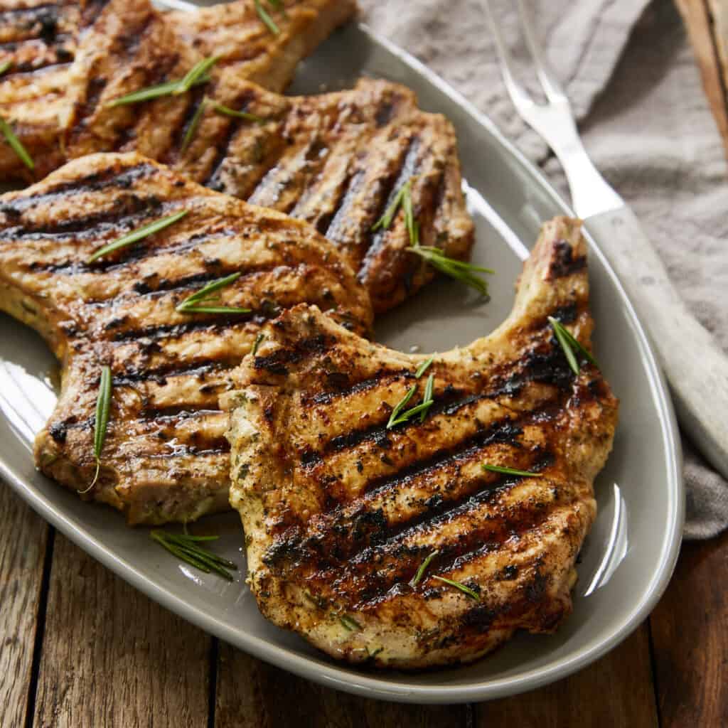 Grilled Pork Chops with Rosemary Dijon Marinade - Little Black Skillet